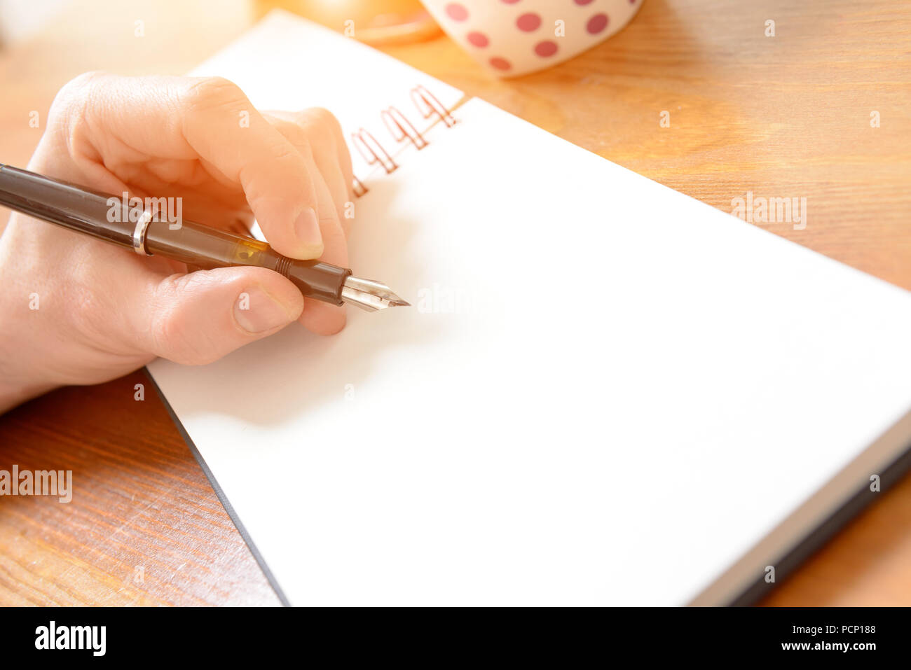 One man writing hand pen notepad hi-res stock photography and images ...