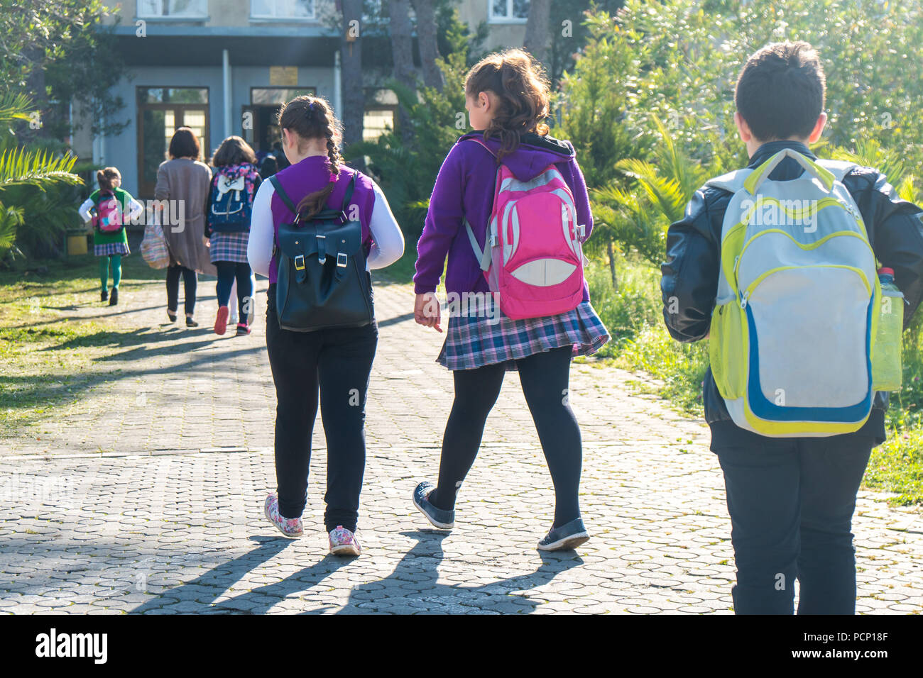 Group of kids going to school, education Stock Photo - Alamy