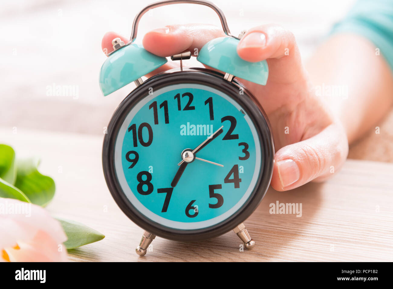 Hand on alarm clock hi-res stock photography and images - Alamy