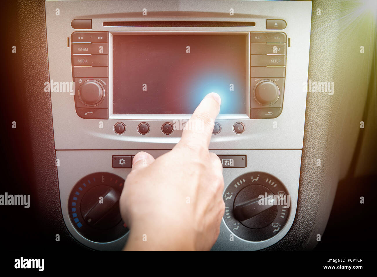 Driver using touchscreen to adjust car navigation or other systems ...