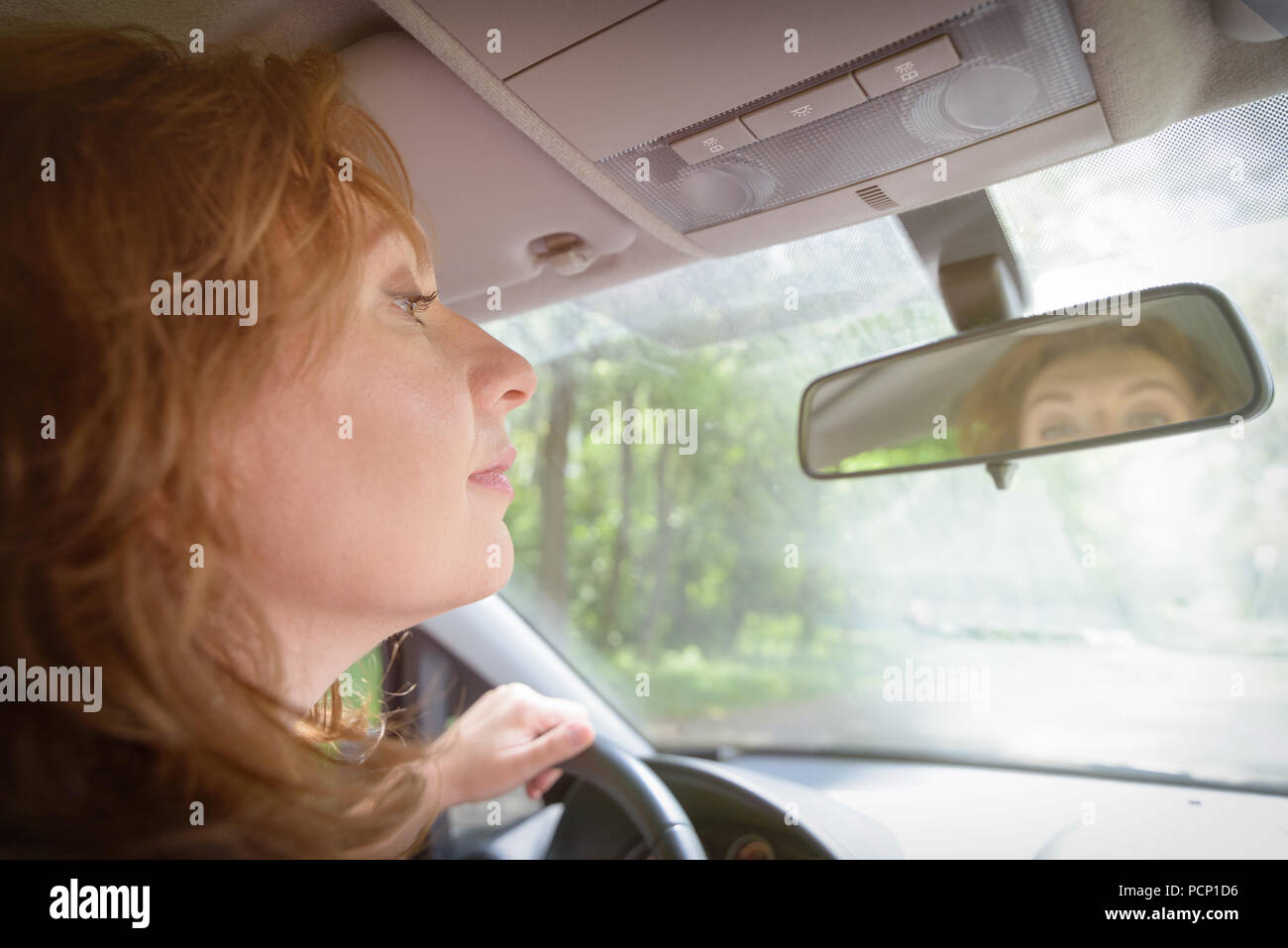 Female checking rear view hi-res stock photography and images - Alamy