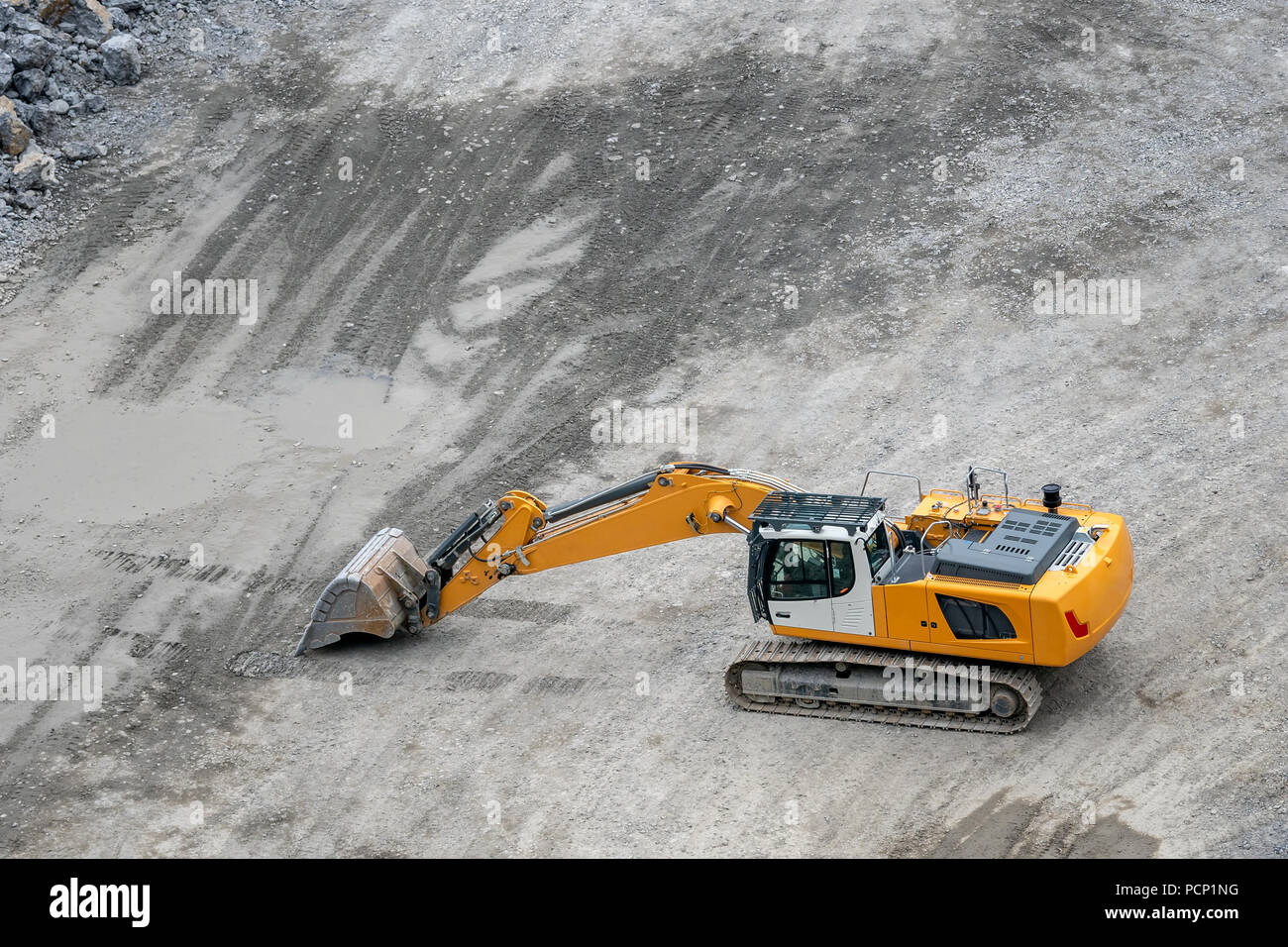Mining in the granite quarry. Working mining machine - digger. Mining ...