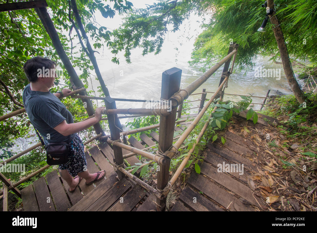Cliffside wooden path over the water from Ao Nang beach to secluded ...