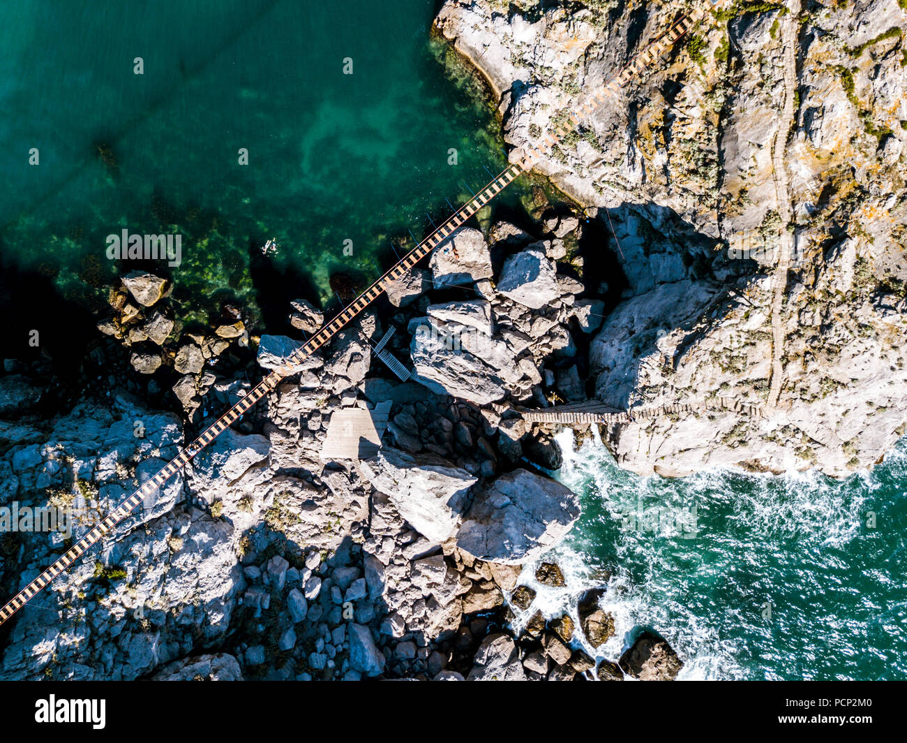 Rope bridge over rocks hi-res stock photography and images - Alamy