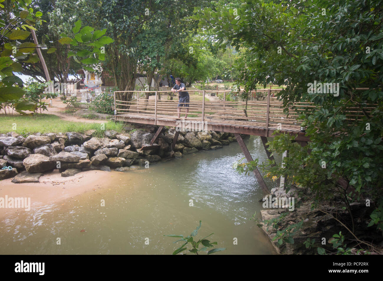Cliffside wooden path over the water from Ao Nang beach to secluded ...