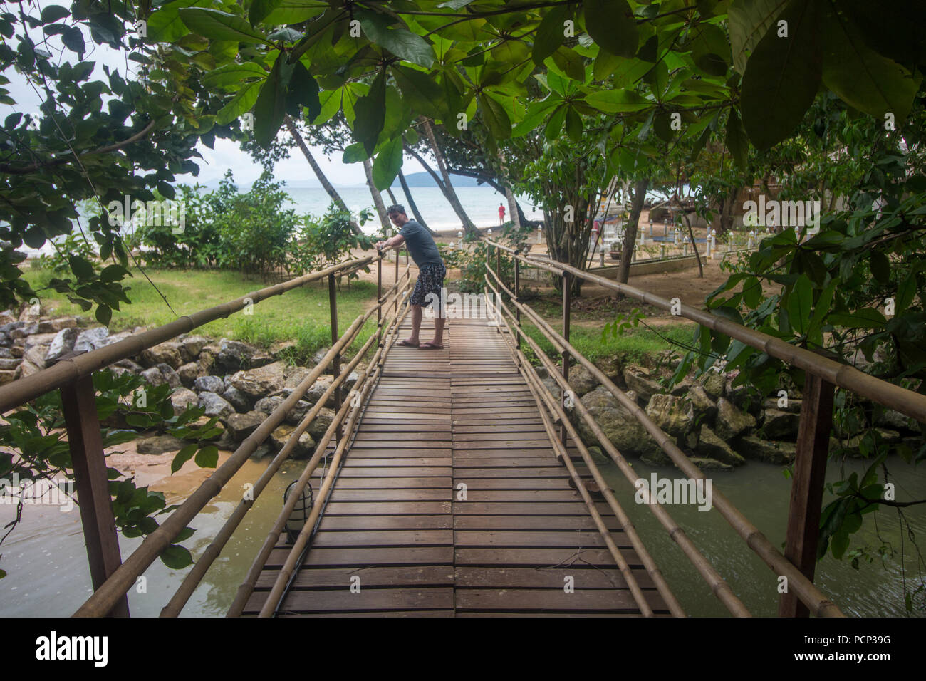 Cliffside wooden path over the water from Ao Nang beach to secluded ...