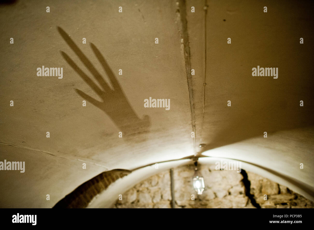 Scary hand shadow on the ceiling in the haunted castle Stock Photo - Alamy
