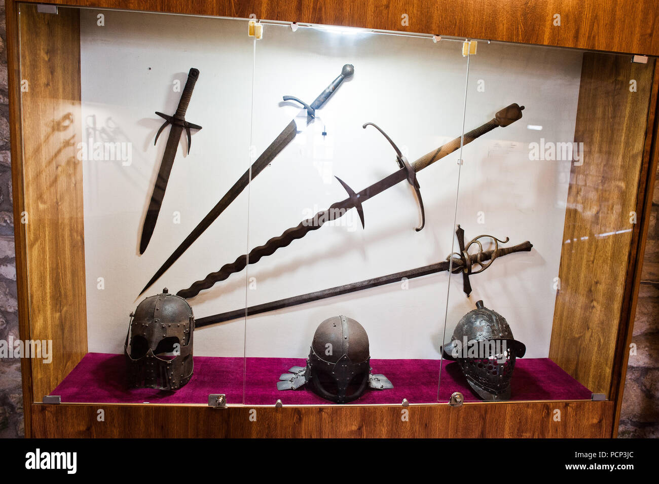 Medieval weapons or tools behind the glass in the museum Stock Photo ...