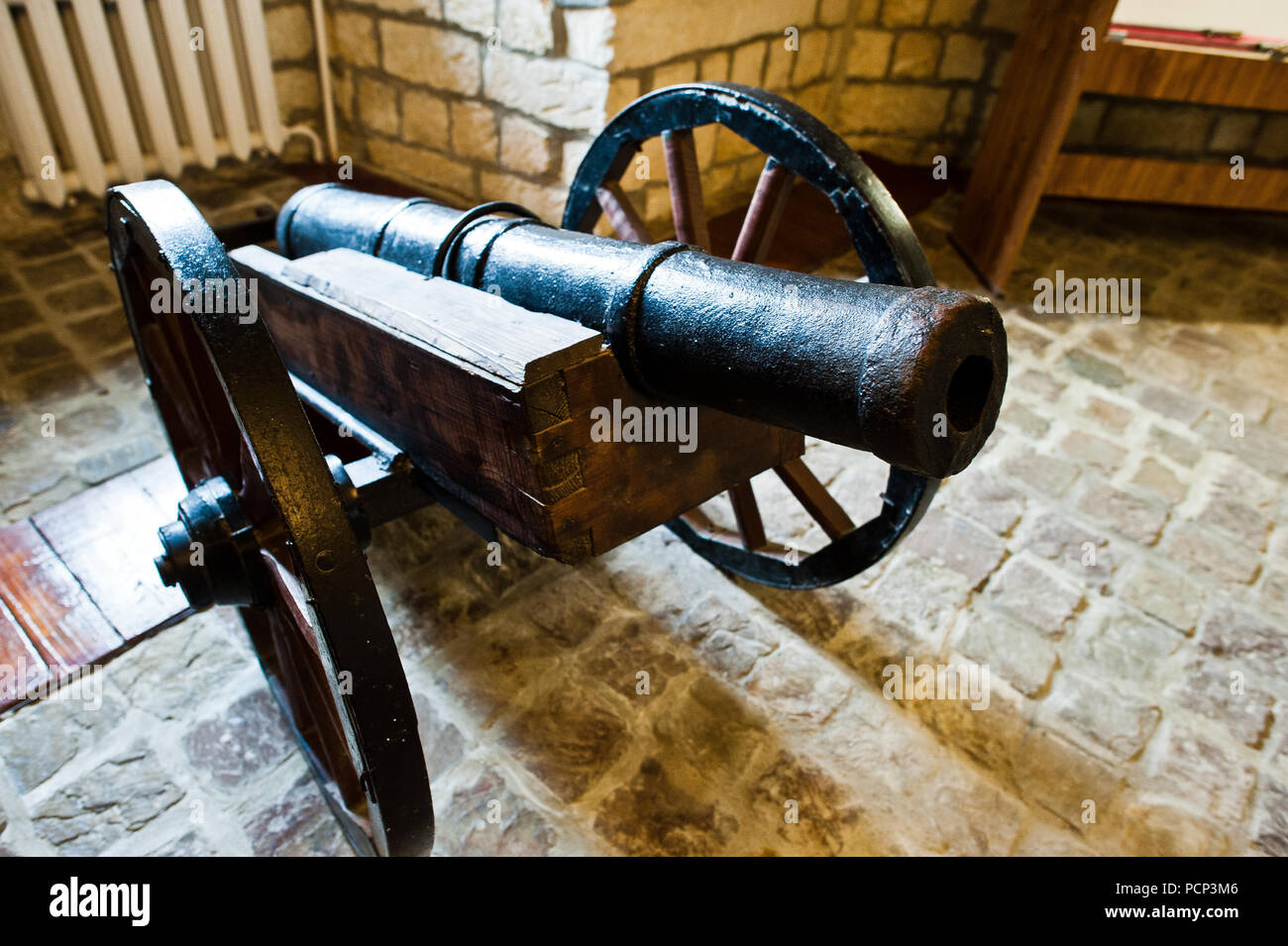 Very old cannon made of iron in museum Stock Photo - Alamy
