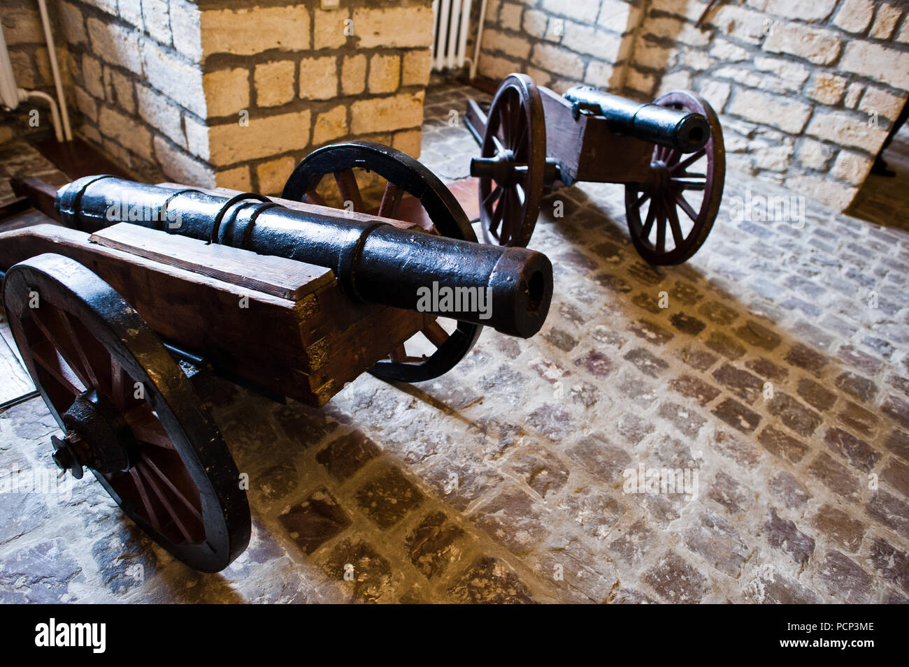 Very old cannon made of iron in museum Stock Photo - Alamy
