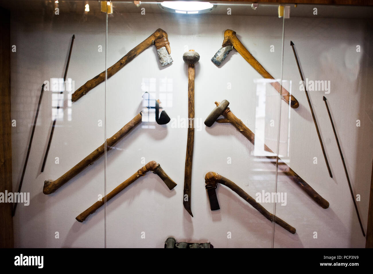 Medieval weapons or tools behind the glass in the museum Stock Photo ...