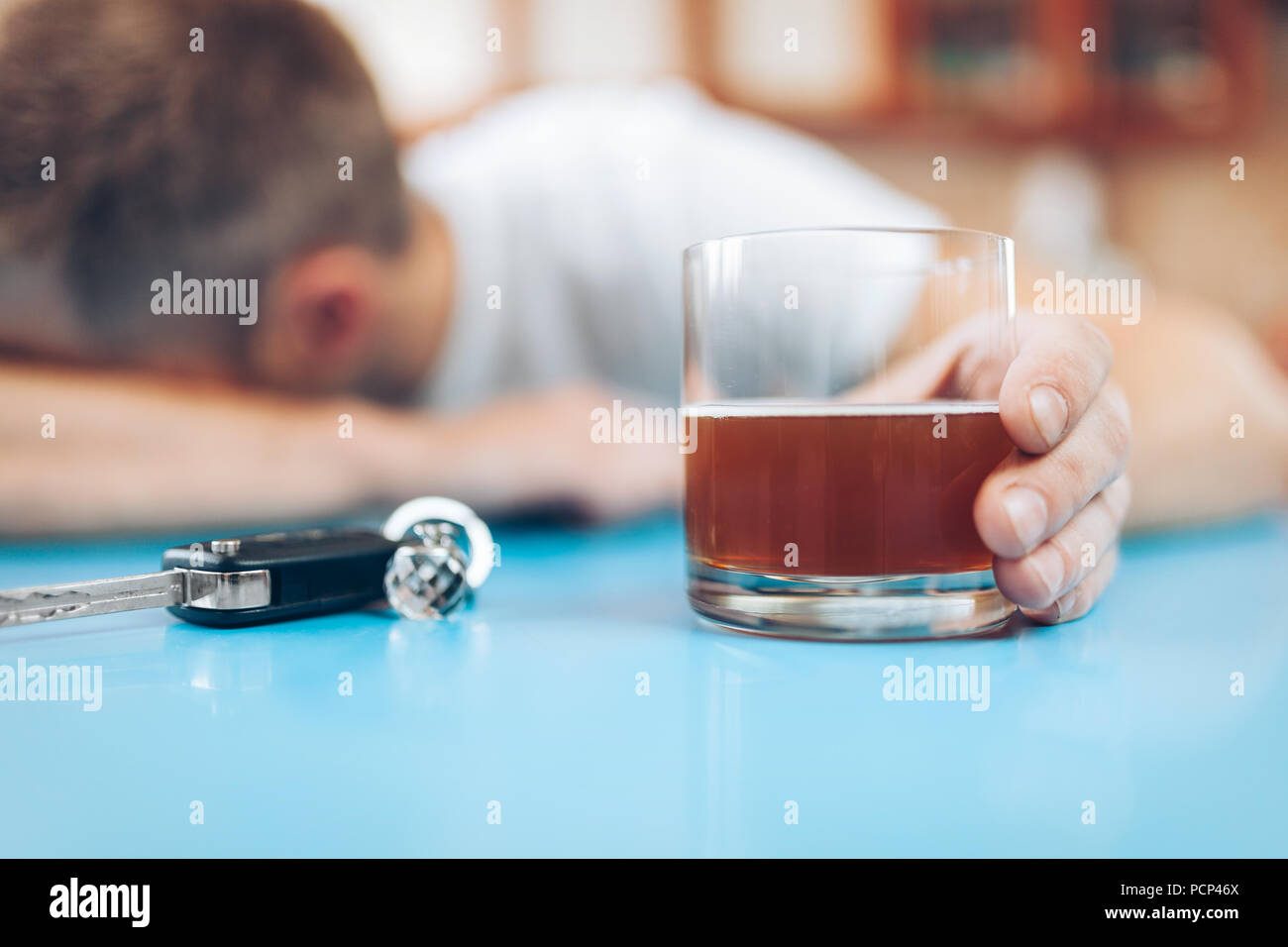 Drunk man at the bar intends to drive back home Stock Photo - Alamy