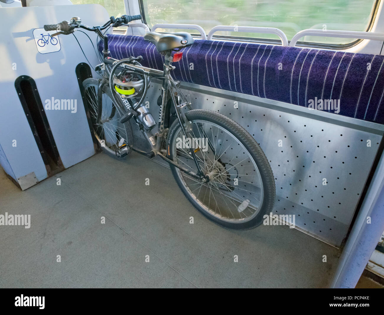 Bicycle travelling by train, bike on train Stock Photo - Alamy