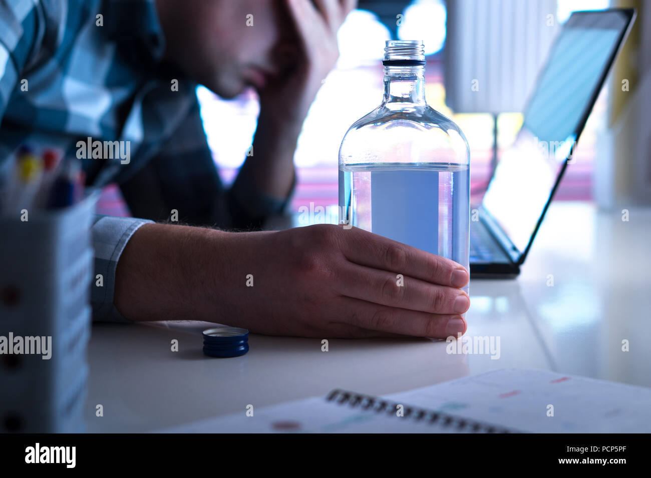 Alcoholism or drinking problem concept. Alcoholic with vodka bottle on ...