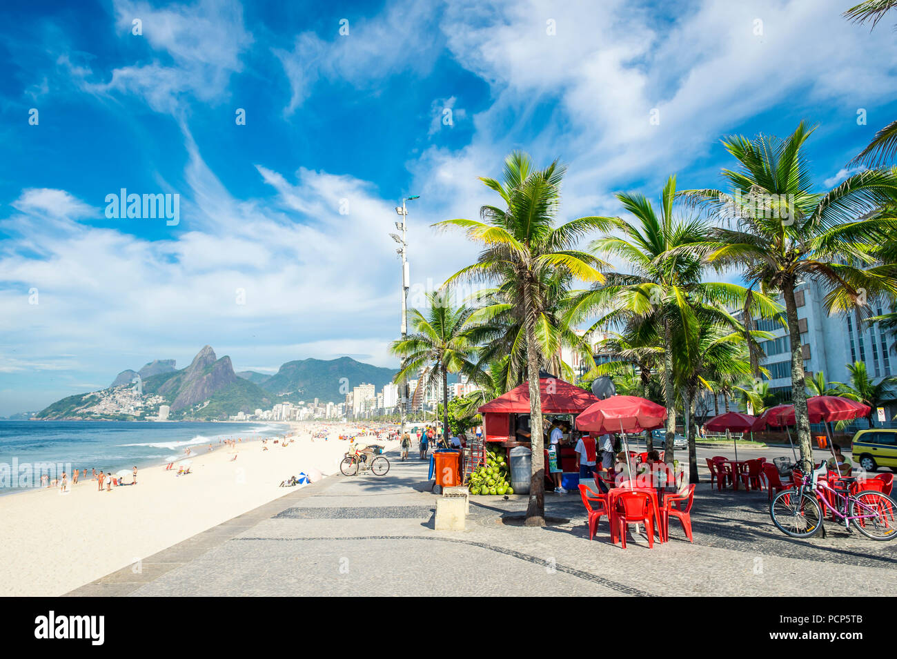 Bright morning view of a kiosk and palm trees on the Ipanema promenade ...