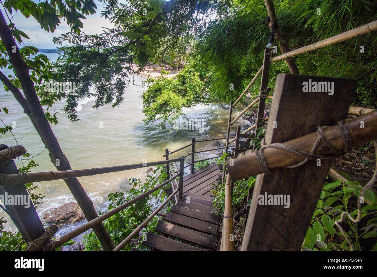 Cliffside wooden path over the water from Ao Nang beach to secluded ...