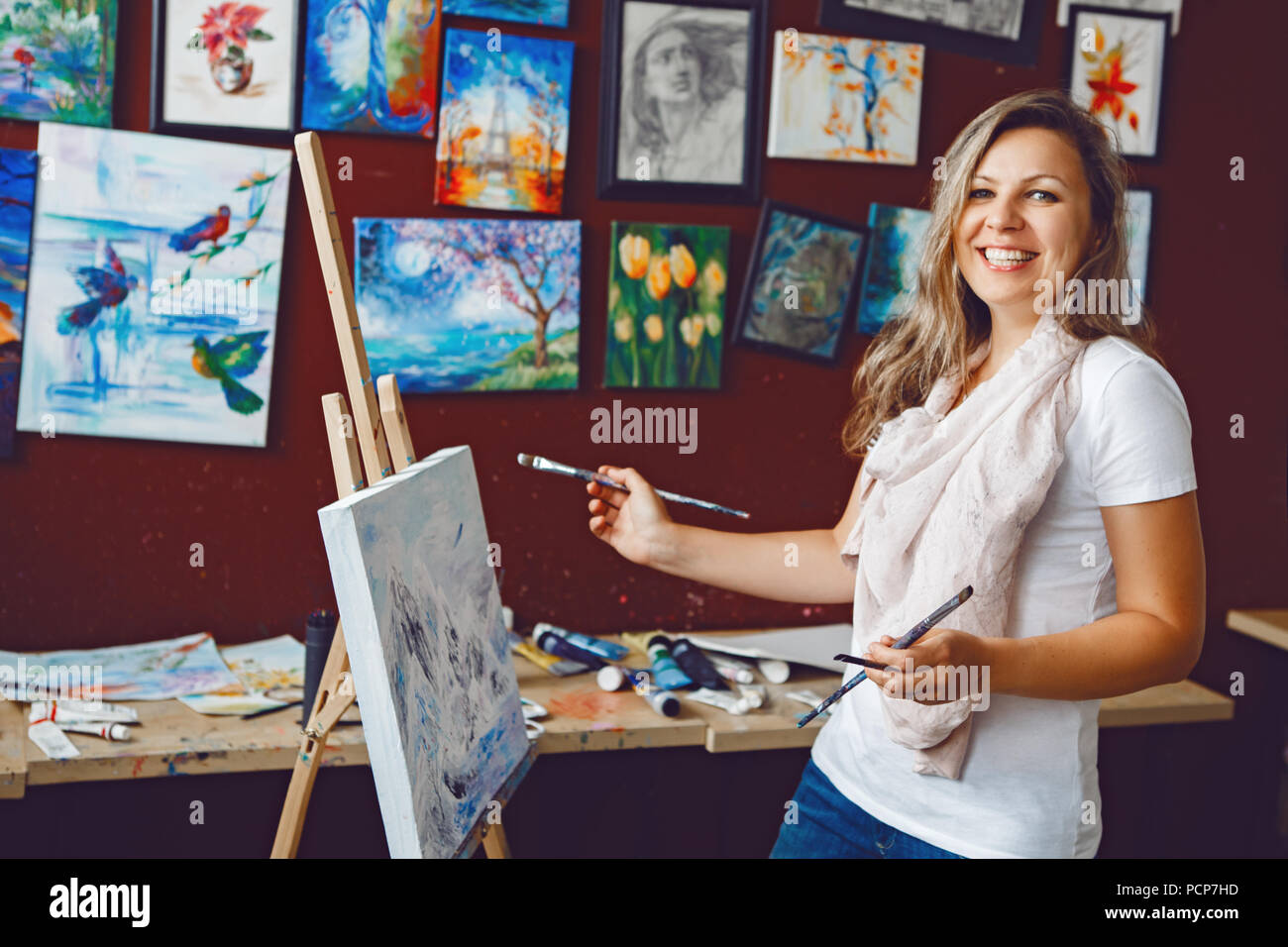 Portrait of young beautiful middle age white Caucasian woman artist ...