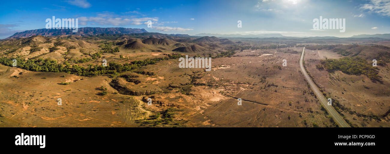 Large aerial panorama of Flinders Ranges mountain range and rural road ...