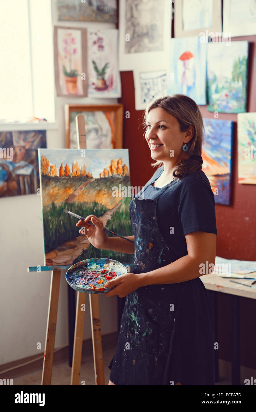 Portrait of young beautiful middle age white Caucasian woman artist ...