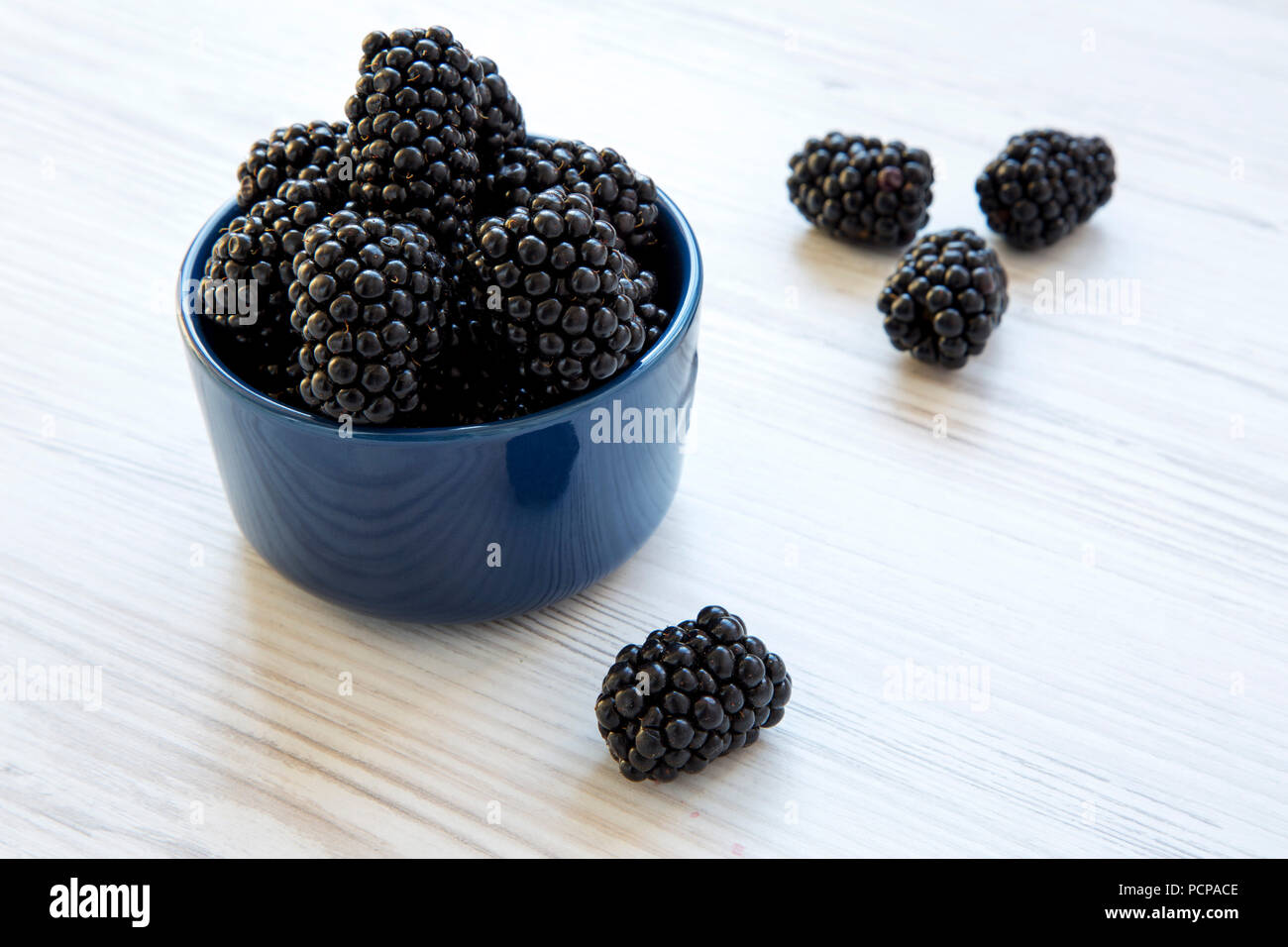 Bowl full of blackberries, side view. Summer berry. Closeup Stock Photo ...