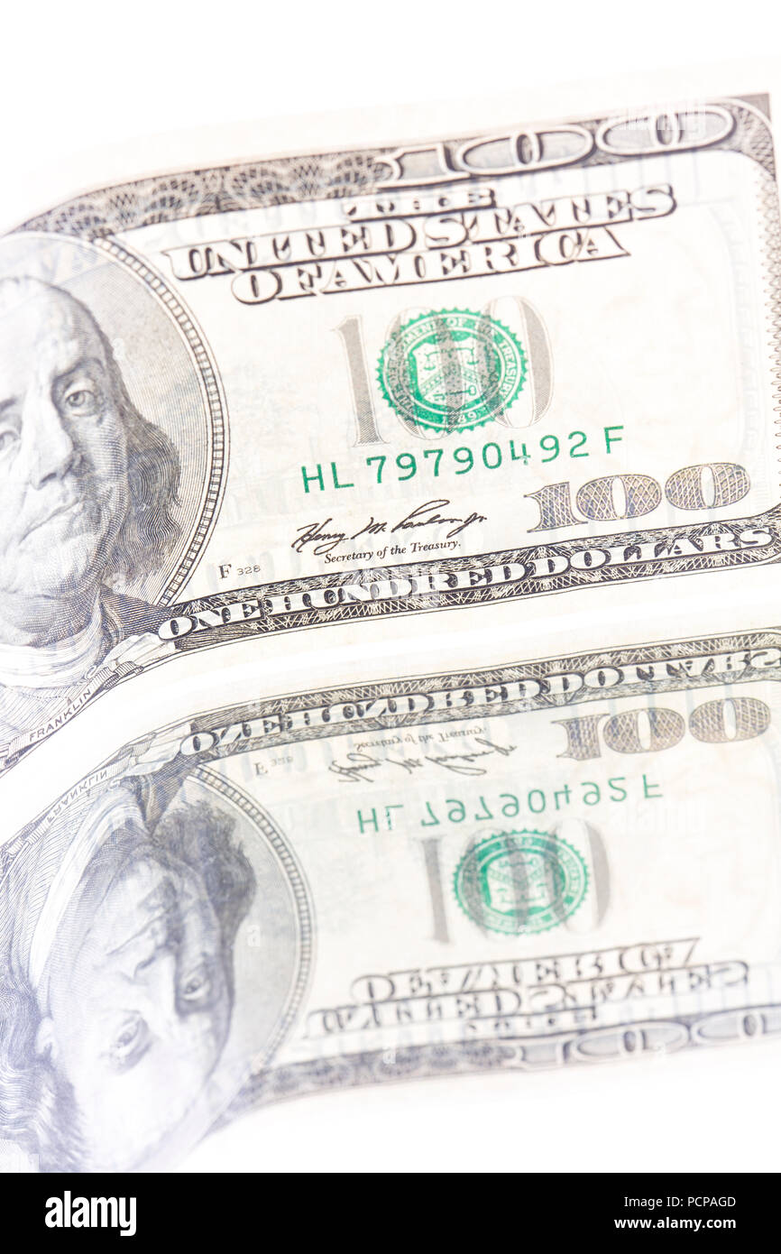 blurred dollar money background and mirror like concept of success ...