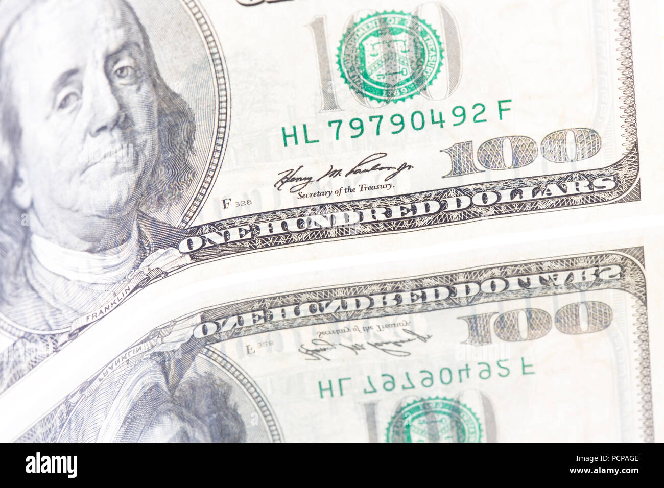 blurred dollar money background and mirror like concept of success ...