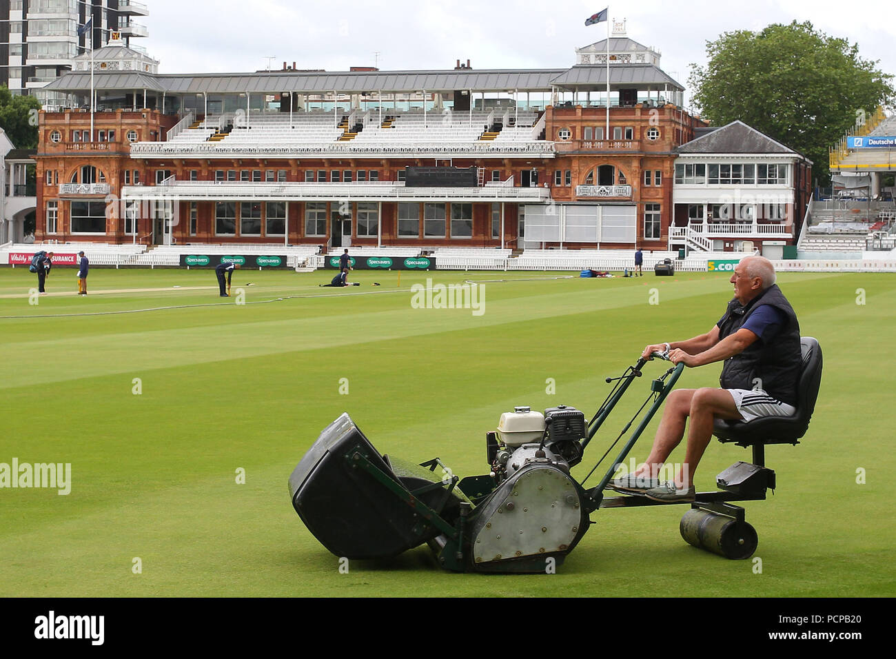 Head groundsman Mick Hunt mows the outfield ahead of Middlesex CCC vs ...