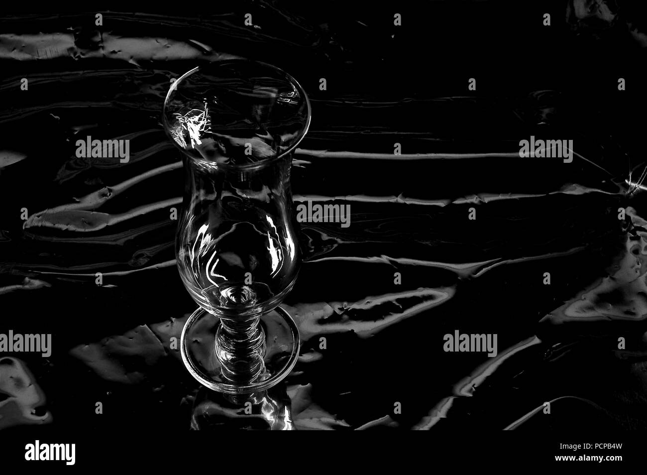 Still life with one empty single modern transparent and fragile ...