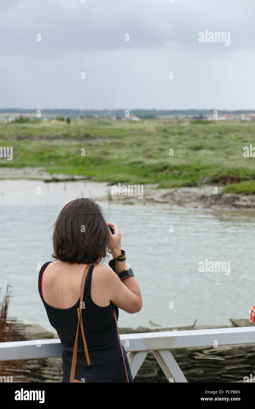 Woman taking photo sea hi-res stock photography and images - Alamy
