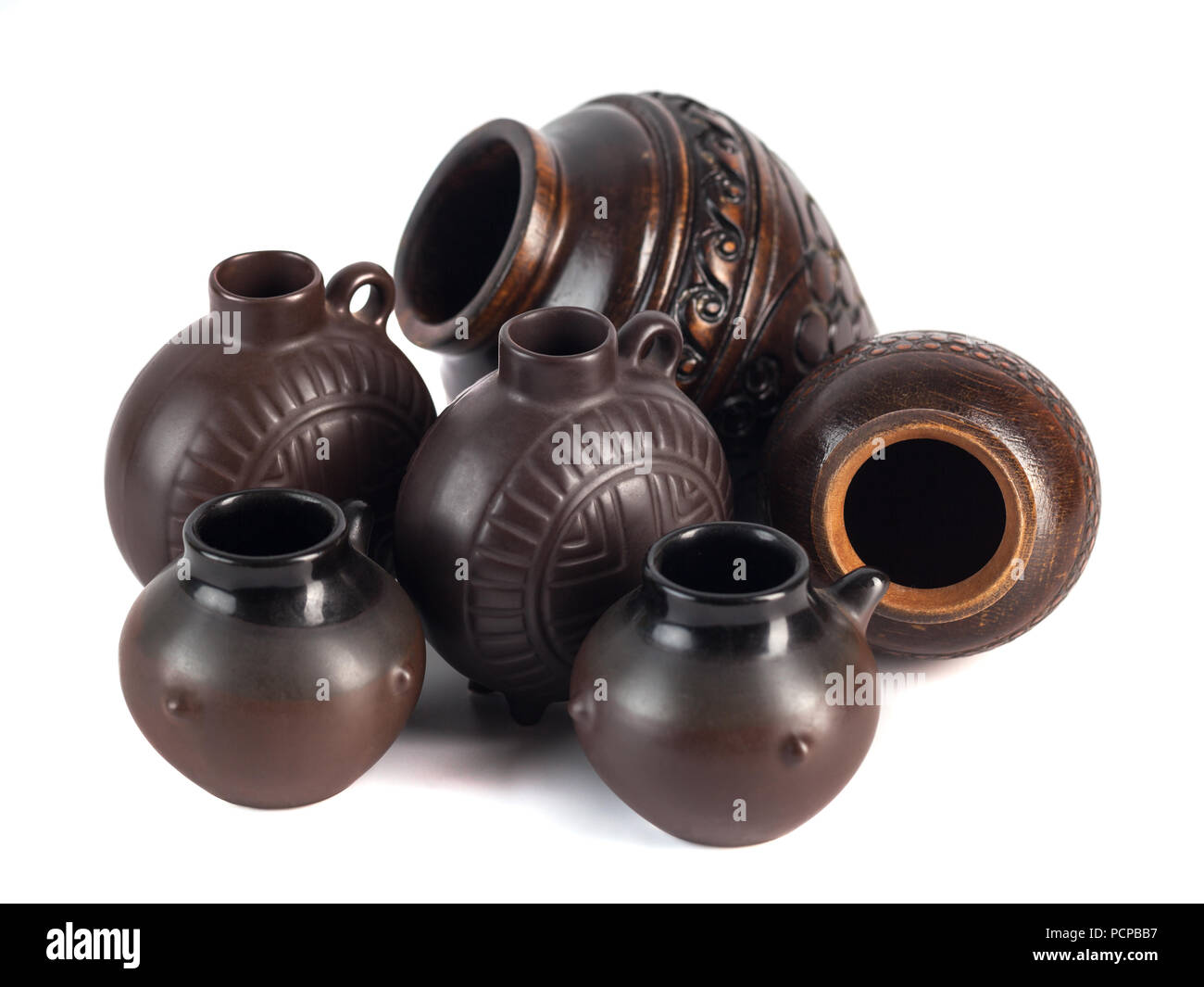 traditional Georgian ceramic utensils (chinchila) for wine on a white ...