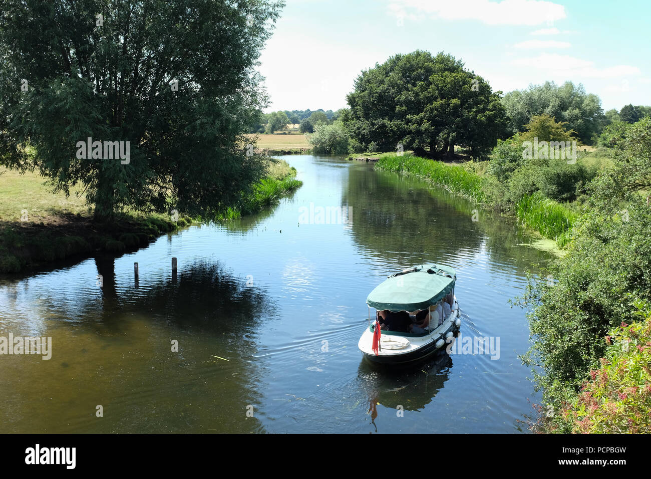 A pleasure boat on the River Stour in Flatford, Suffolk, England Stock ...