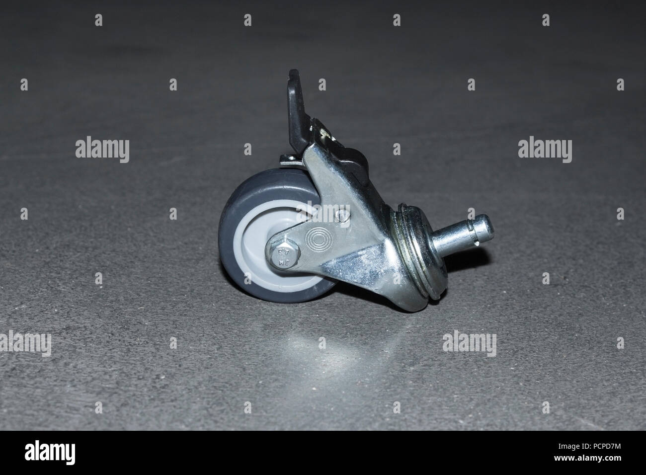 Industrial heavy weight wheel with break unit on concrete Stock Photo ...