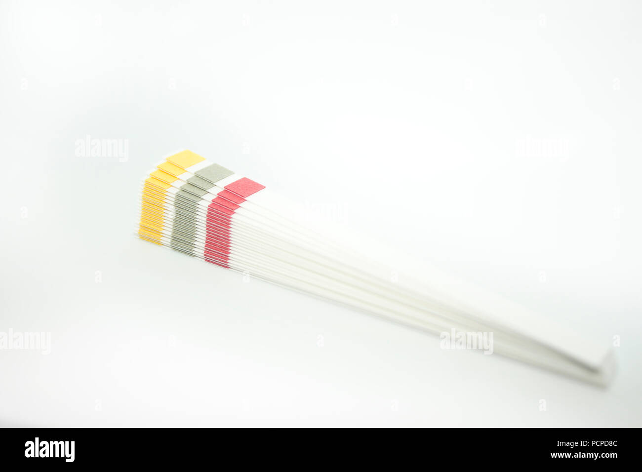 Isolated pH indicator paper on white background Stock Photo - Alamy