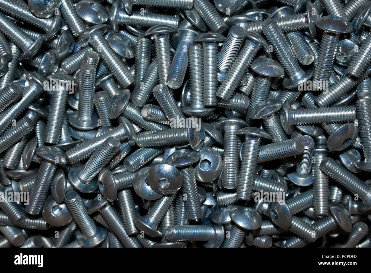 Pile of galvanized metal steel allen head screws Stock Photo - Alamy