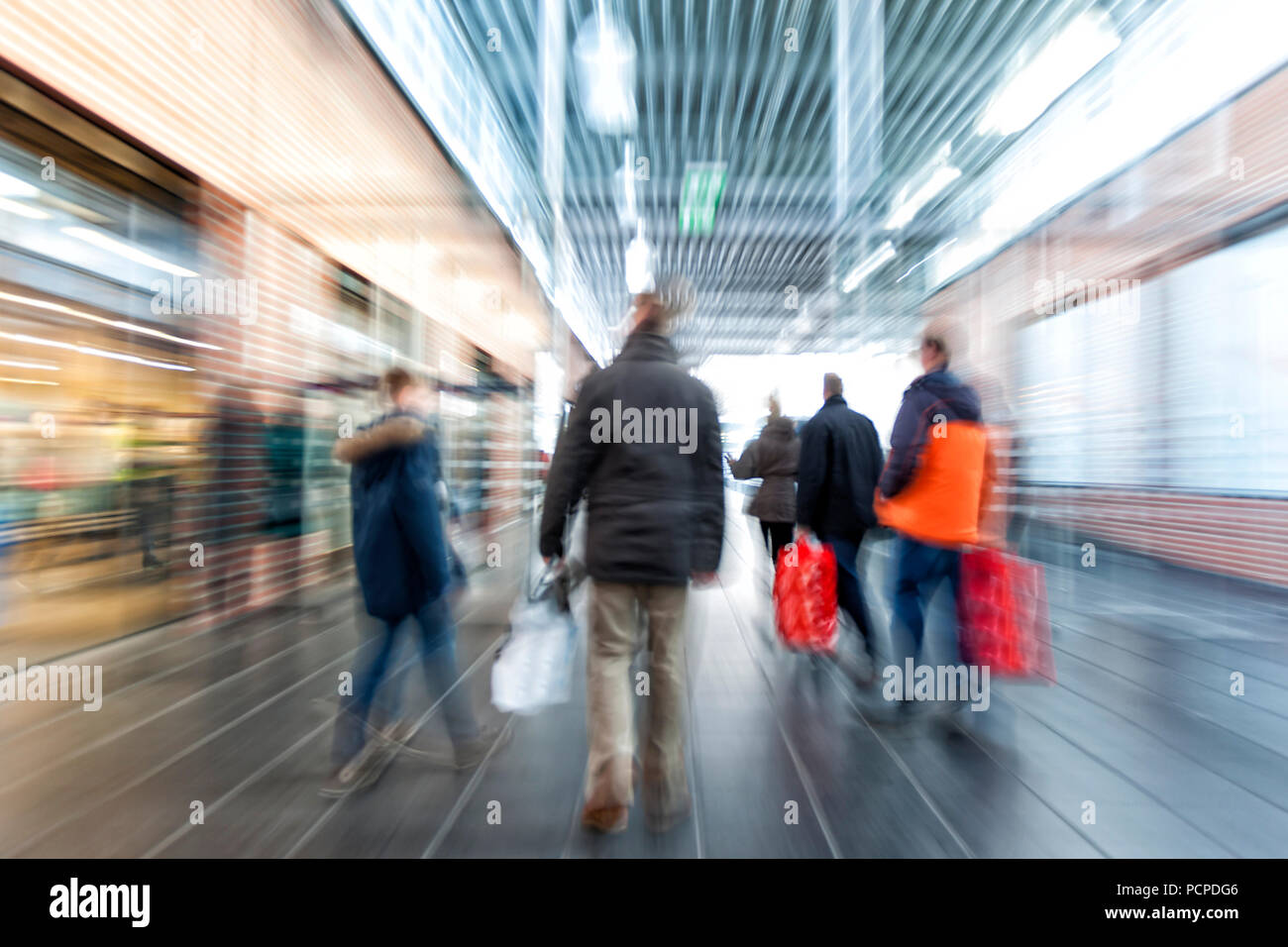 Crowd of people rushing through corridor, zoom effect, motion blur ...