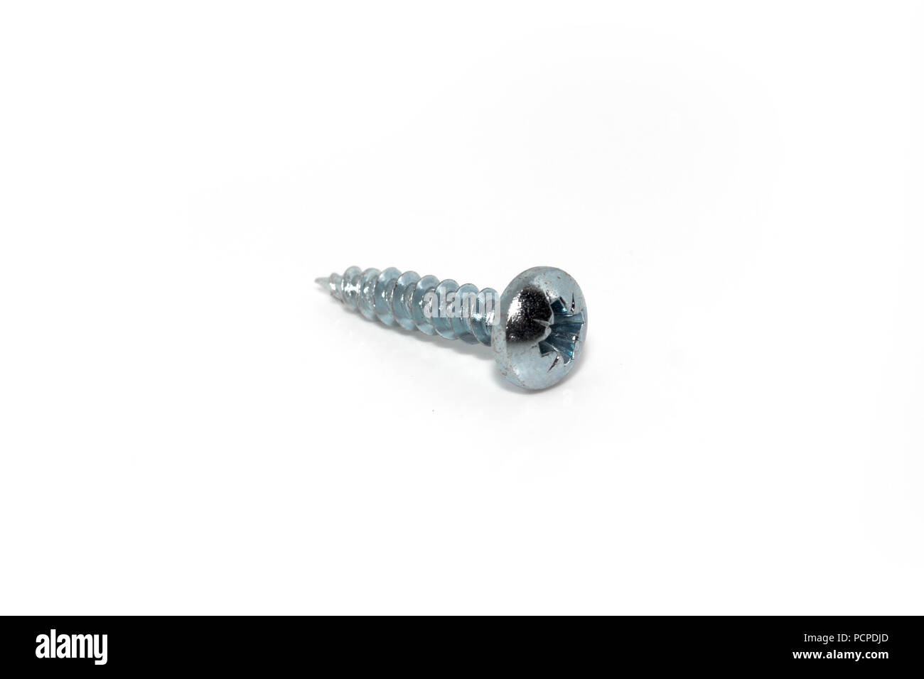 Single isolated galvanized industrial steel screw on white background ...