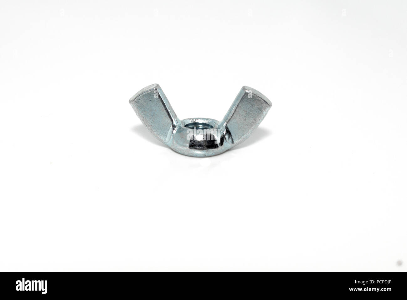Single isolated galvanized industrial wing bolt on white background ...