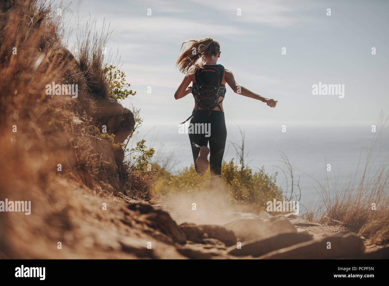 Rear view of female runner hi-res stock photography and images - Alamy