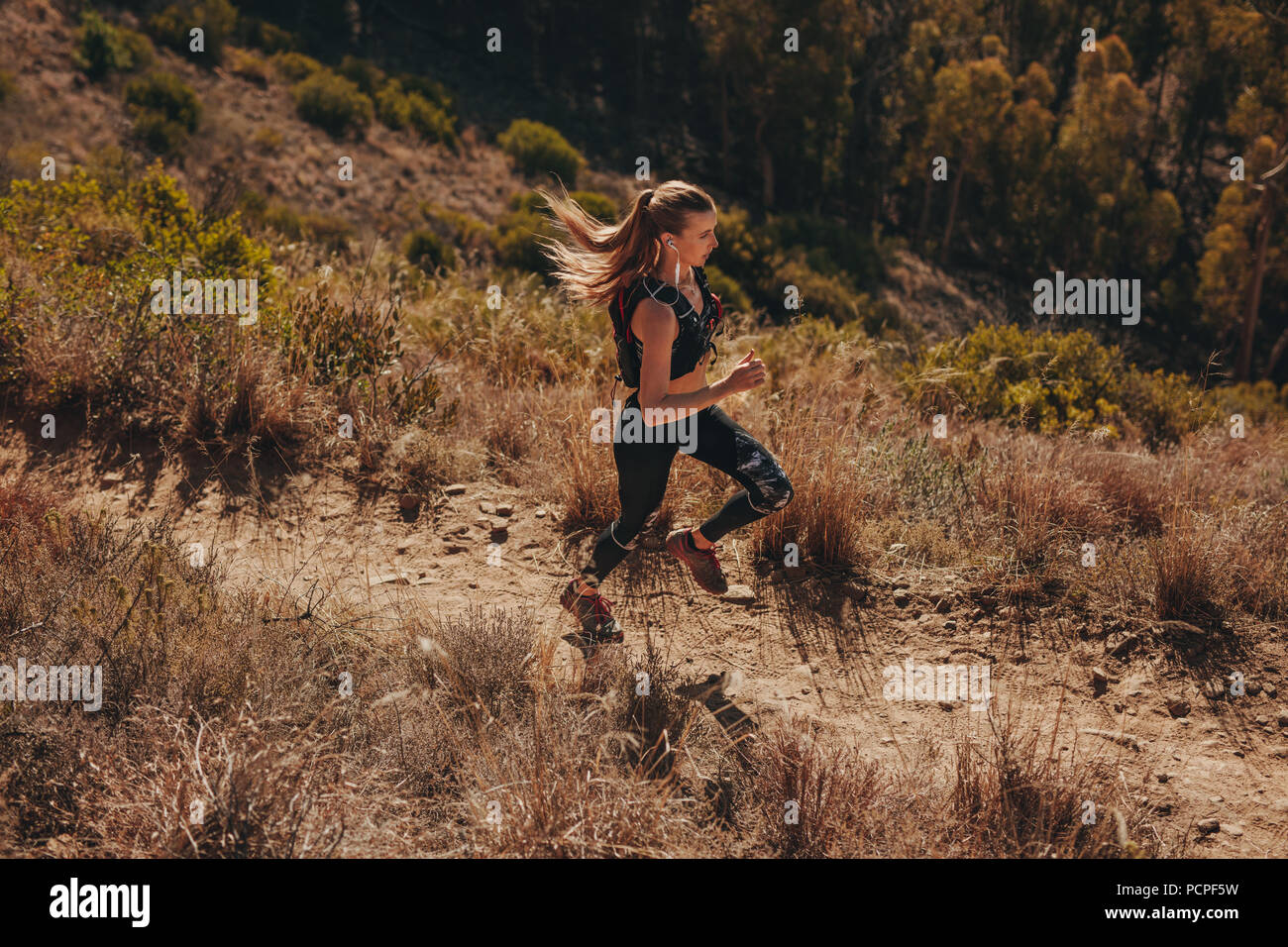 Runner at top of hill hi-res stock photography and images - Alamy