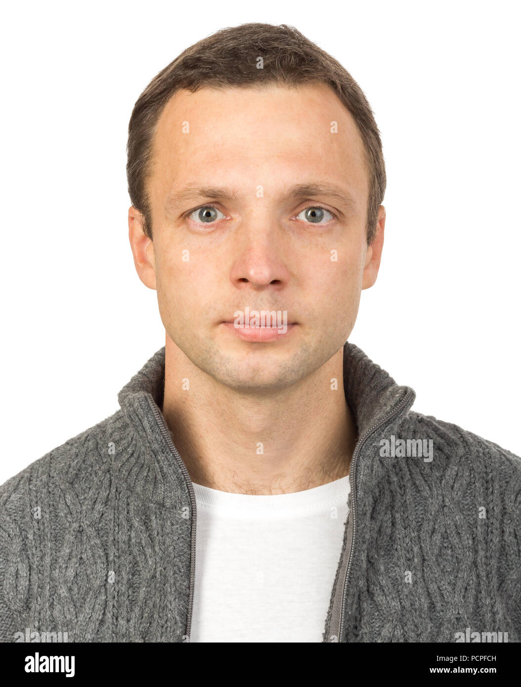 Studio portrait of young European man isolated on white background ...