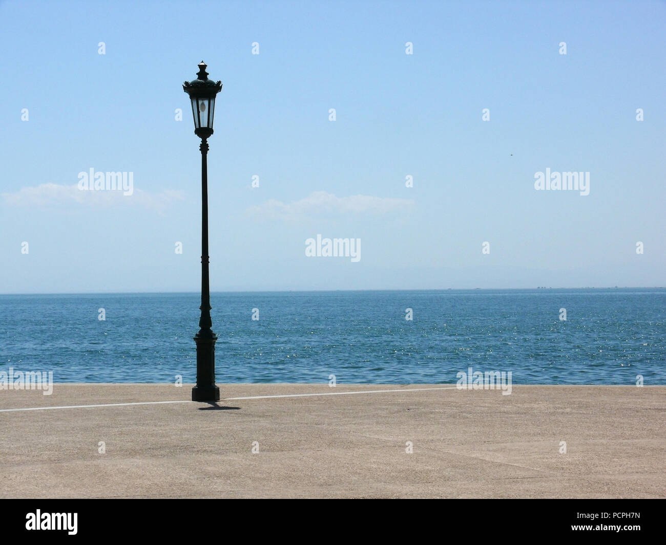 Lamppost on a quay platform by the sea in a Mediterranean city Stock ...