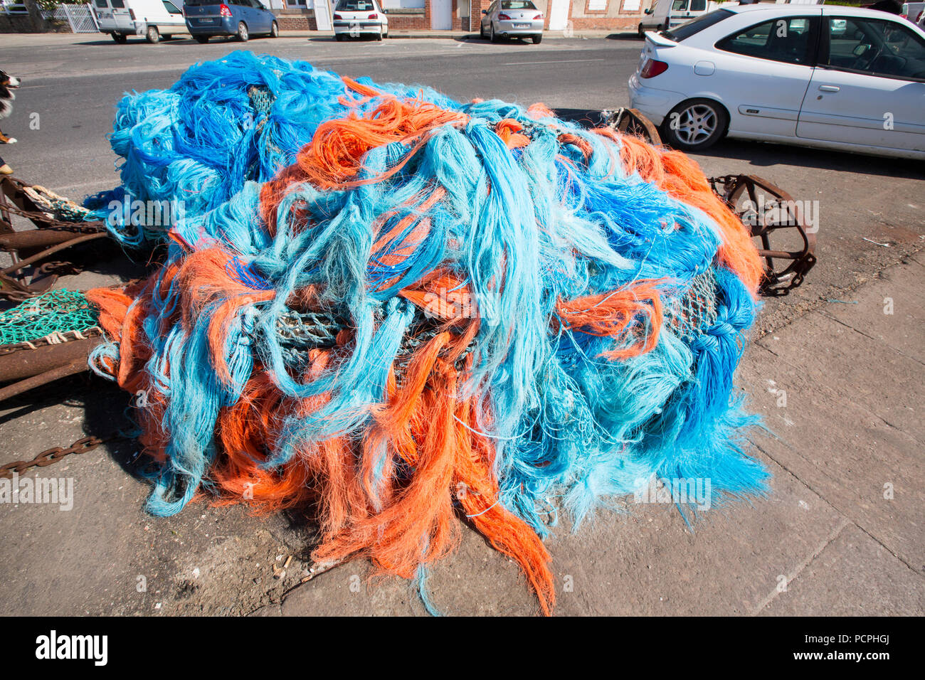 Old discarded fishing gear in Barfleur harbour, Normandy, France Stock ...