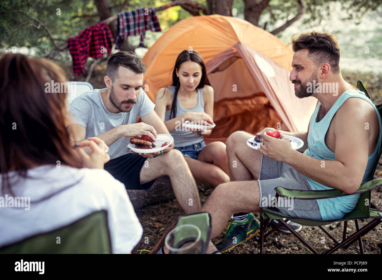 Group family party camping friends hi-res stock photography and images ...