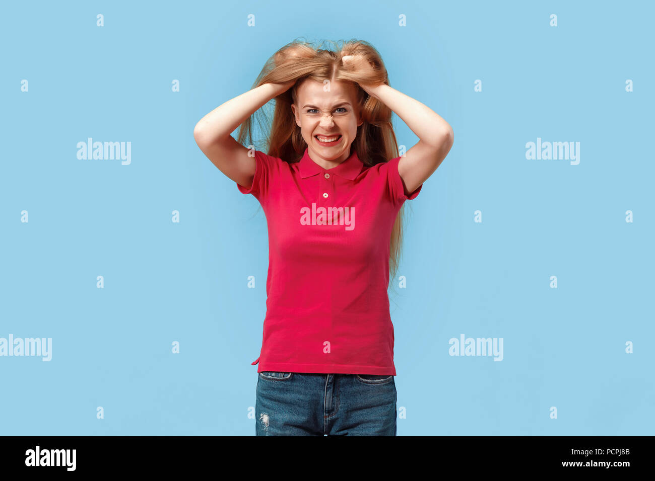 The young emotional angry and scared woman standing and looking at ...