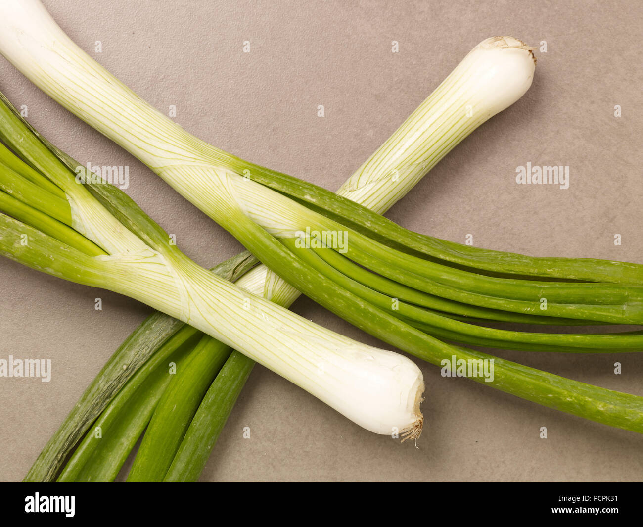 Spring onion stalks food still-life Stock Photo - Alamy