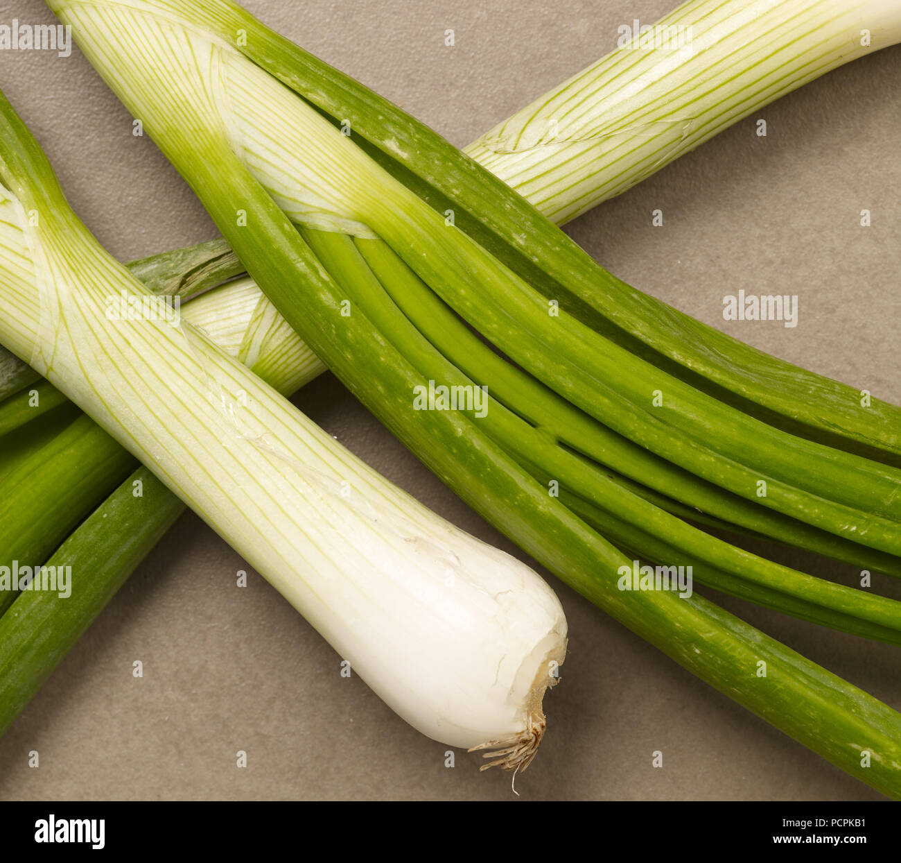 Spring onion stalks food still-life Stock Photo - Alamy