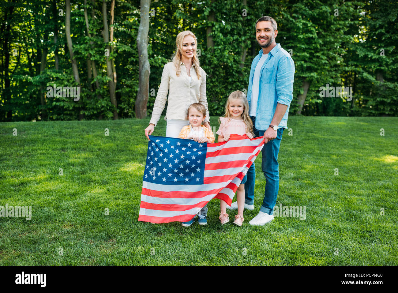 Children holding american flag in hi-res stock photography and images ...