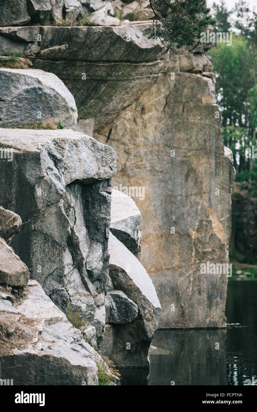 close-up shot of dramatic rocky cliff over lake Stock Photo - Alamy