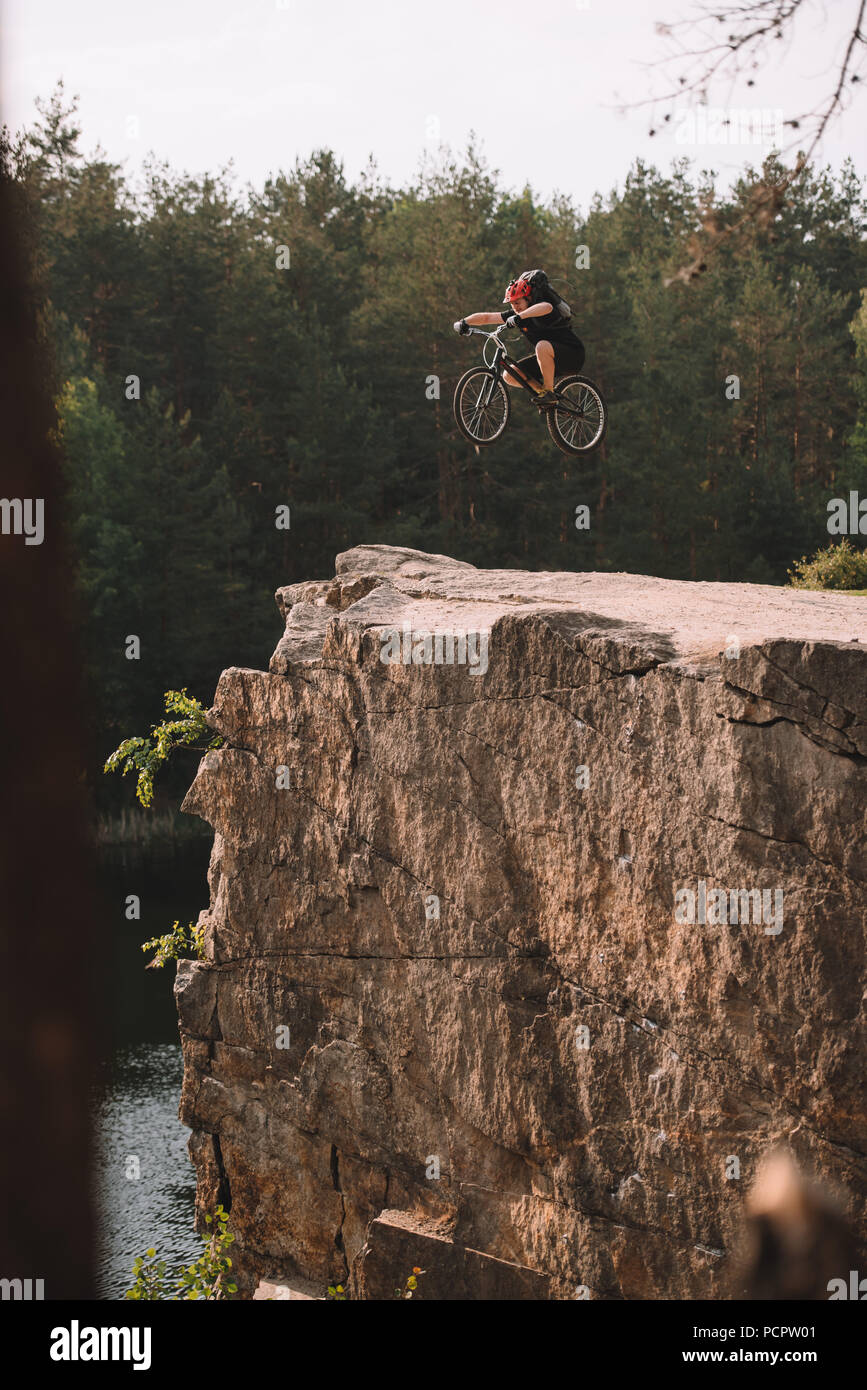 Man jumping over rocks hi-res stock photography and images - Alamy