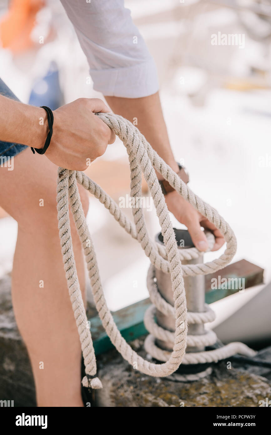 Hands holding boat rope hi-res stock photography and images - Alamy
